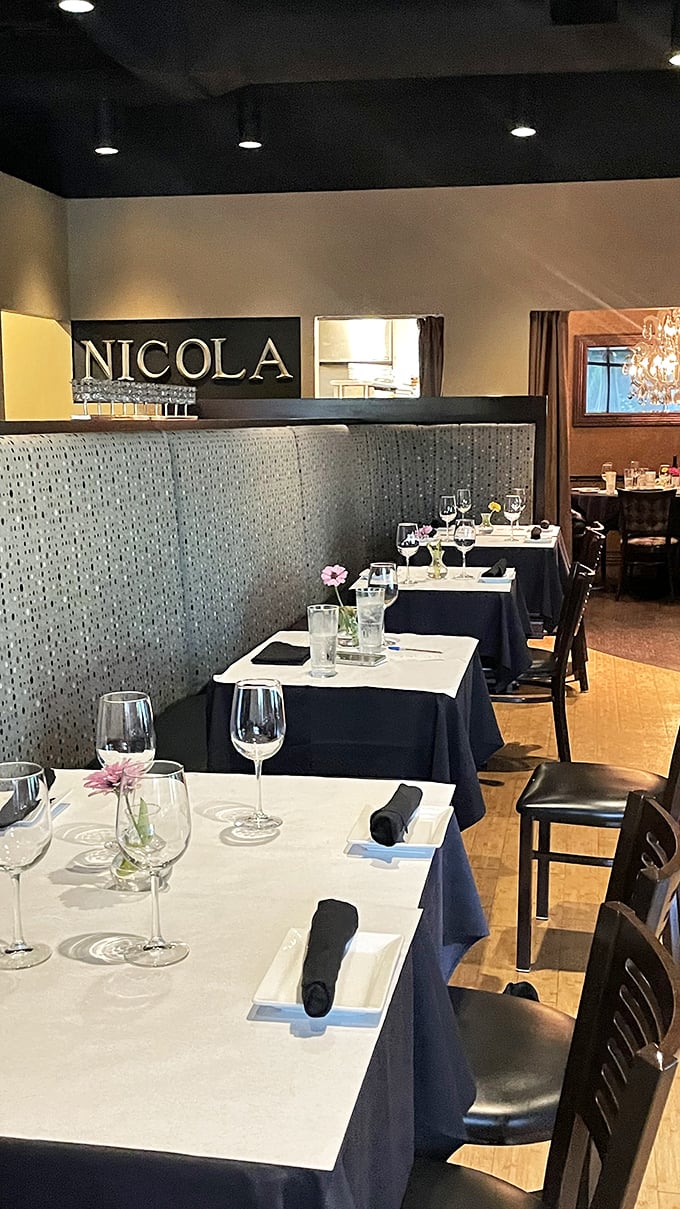 The dining area's sleek design and sparkling glassware whisper "special occasion" while the comfortable seating says "stay awhile, friend."