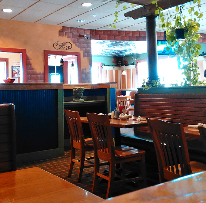 Cozy booths and warm wood tones create dining nooks where breakfast conversations flow as freely as the coffee.