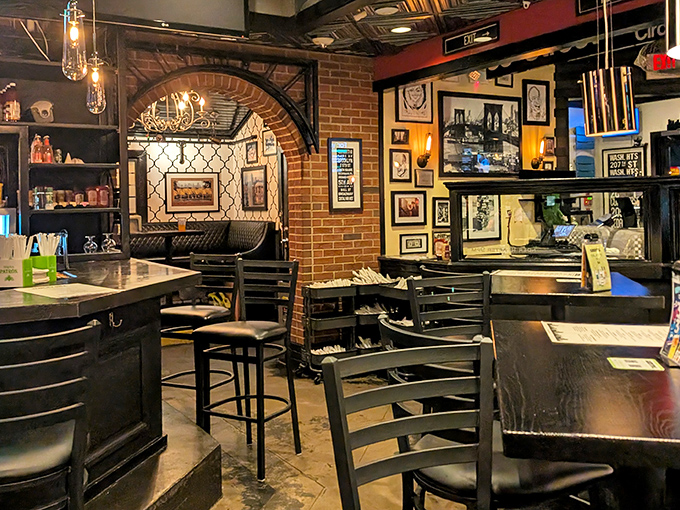 Brick archways and vintage photographs create the perfect backdrop for sandwich-induced euphoria. This isn't just dining; it's time travel.