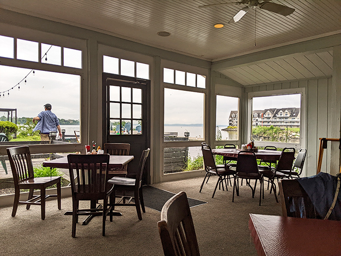 The enclosed porch dining area offers front-row seats to nature's daily performance. Water views and good food&mdash;a combination that never goes out of style.