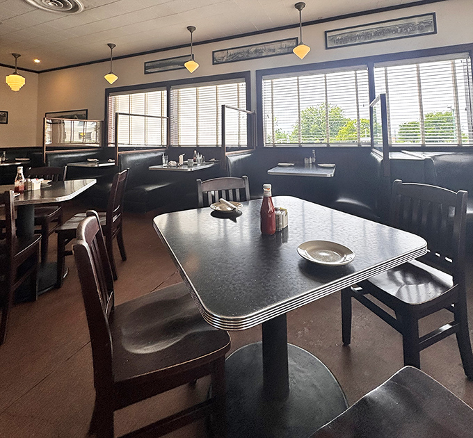 Another angle reveals the timeless diner atmosphere where conversations flow as freely as coffee refills.