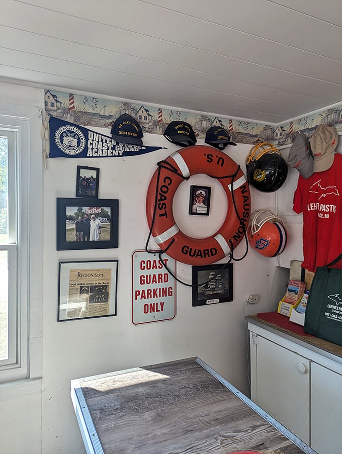 Coast Guard memorabilia and lighthouse-themed wallpaper border create a distinctly Great Lakes atmosphere, reminding you you're in a special corner of Michigan.