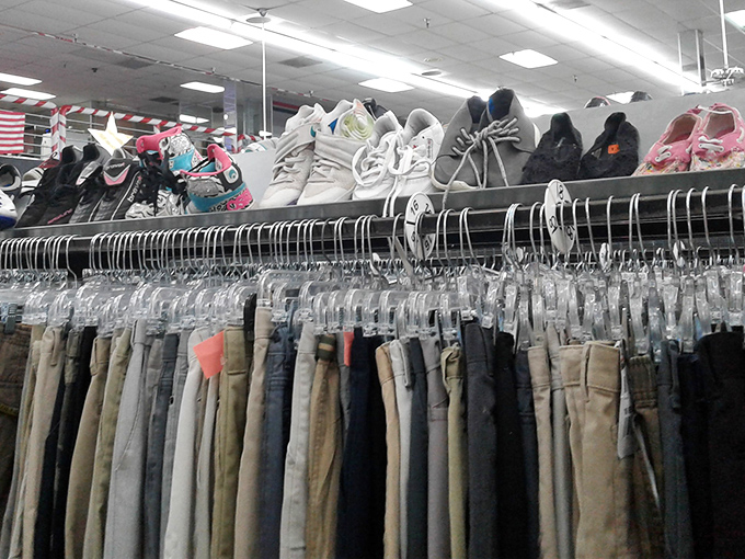 Denim dreams stacked neatly below sensible shoes. Someone's "too tight" is about to become someone else's perfect fit.