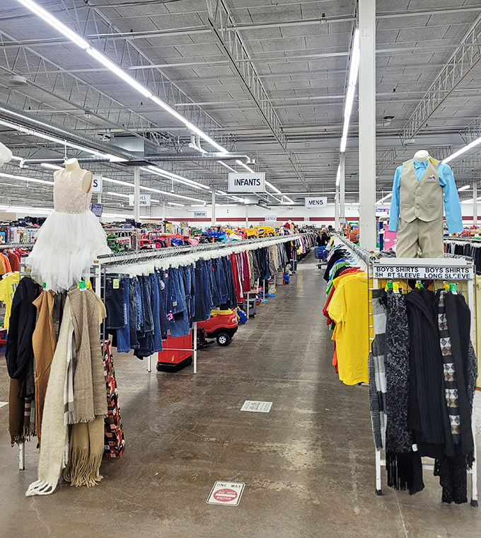 The children's clothing section, where formal wear meets play clothes. That little white dress could be a flower girl's dream or a princess costume.