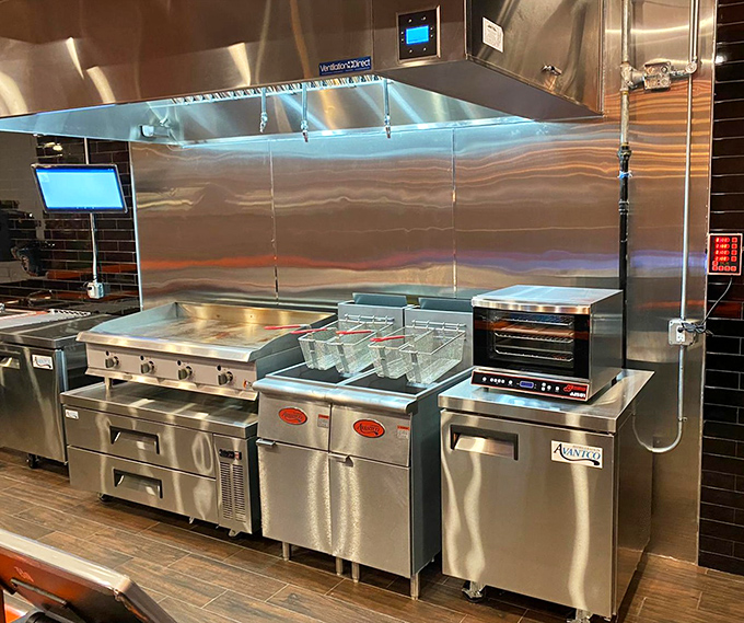 The gleaming kitchen&mdash;spotless stainless steel where burger dreams become reality. Like NASA for comfort food. 