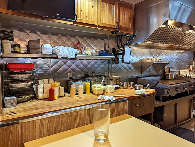 The kitchen at Solly's&mdash;where butter dreams are born. That quilted stainless steel backdrop is basically the Hollywood backdrop for comfort food.