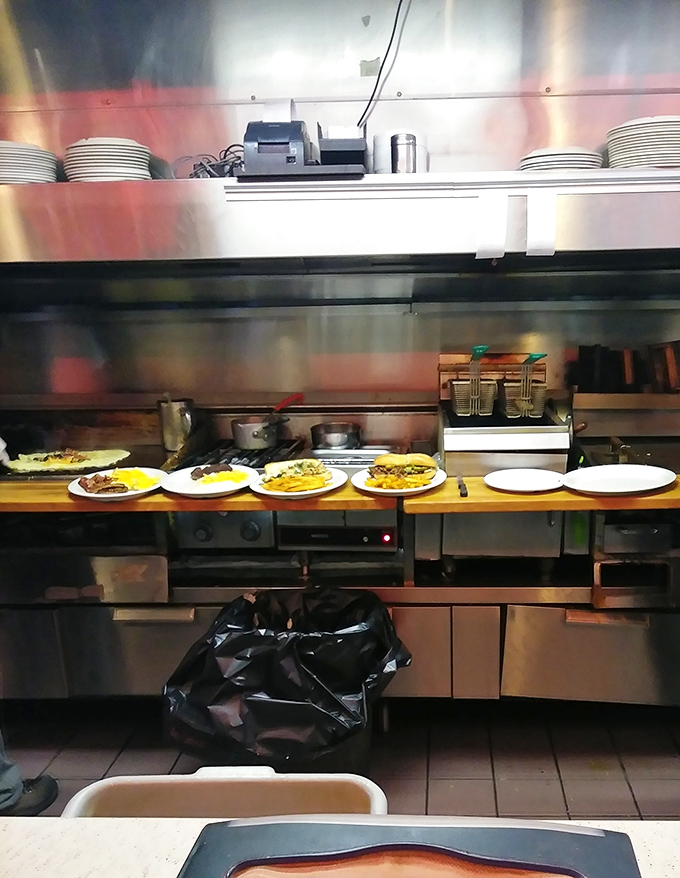Where the magic happens&mdash;a kitchen view that reveals the choreographed dance of short-order cooking. Those plates lined up like soldiers ready for delicious duty.