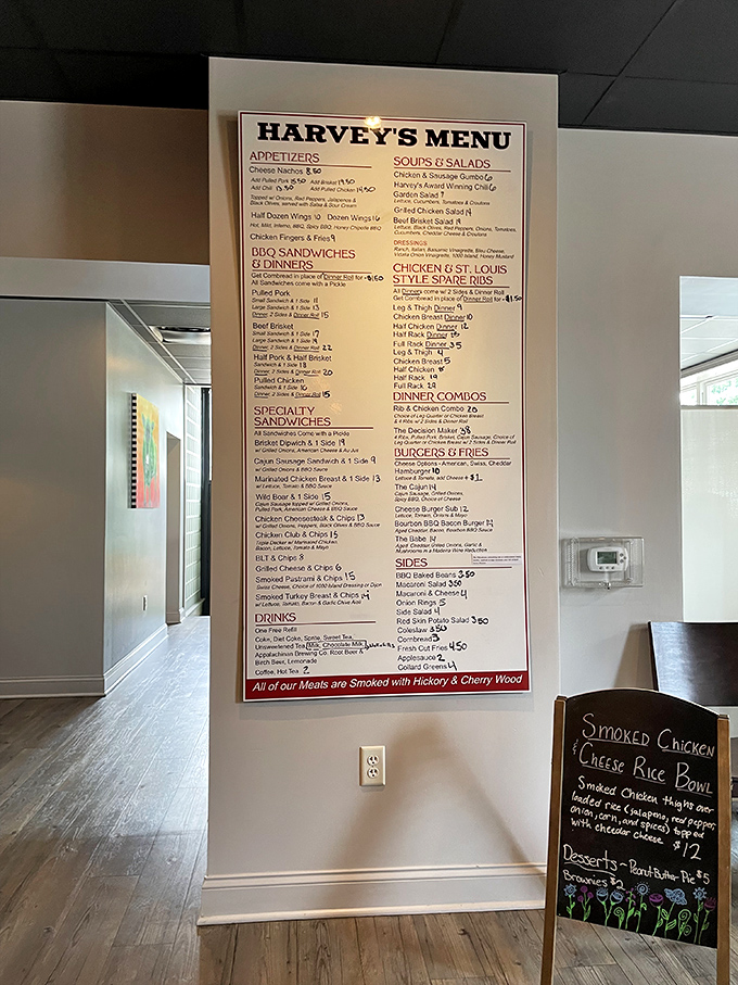 The wall-sized menu board doesn't just list options &ndash; it presents a roadmap to happiness with that little note confirming everything's smoked with hickory and cherry wood.