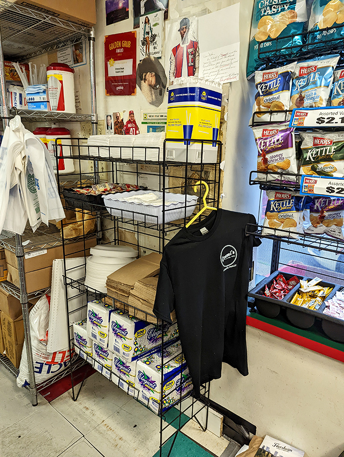The wall of snacks and merchandise&mdash;because when you've finished your sandwich, you might need emergency provisions for later.