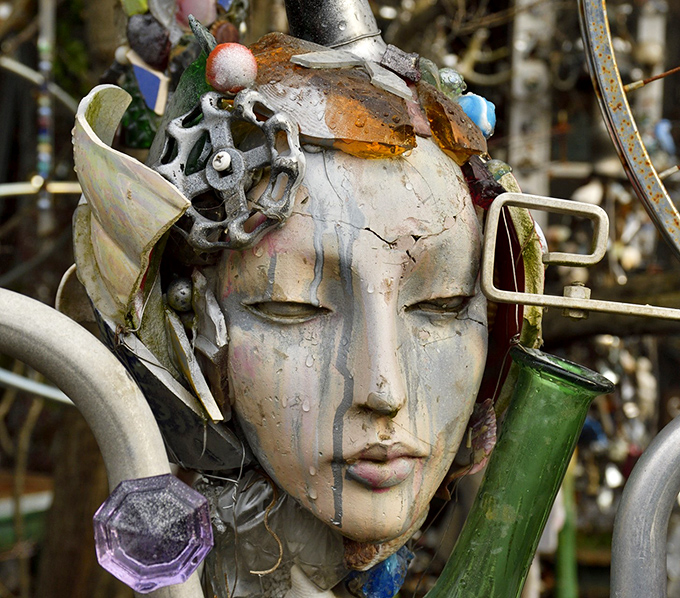 Weather-worn and wonderful, this face emerges from the metallic tapestry like a modern Medusa&mdash;hypnotizing rather than petrifying passersby.