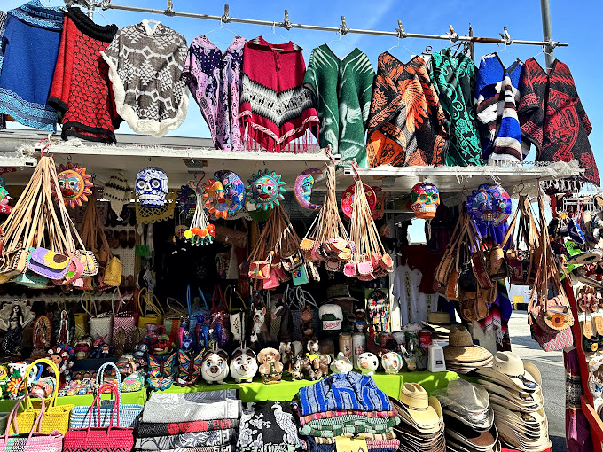 Vibrant textiles and traditional crafts create a rainbow of culture under one festive tent.