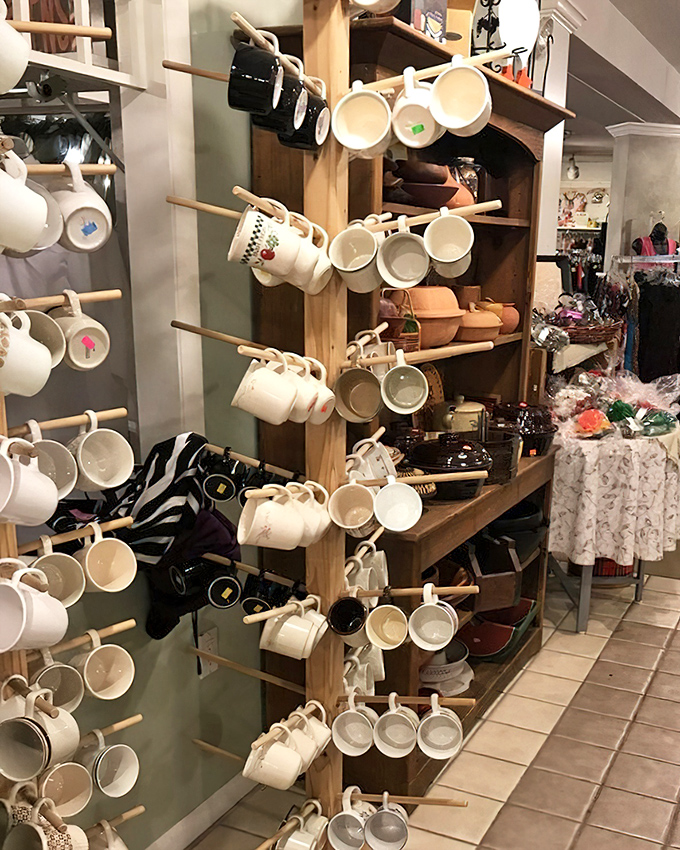 Mugs hanging like stories waiting to be poured. Each one held someone's morning ritual before finding its way here.