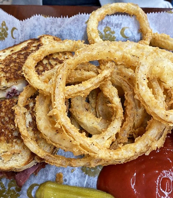 Crispy, golden onion rings that shatter with each bite, paired with a sandwich that means business. This isn't fast food&mdash;it's good food, served fast.
