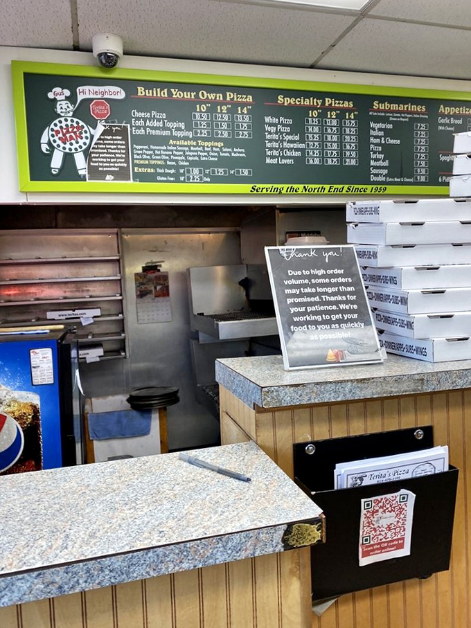 Behind the counter, where pizza magic happens daily. Simple surroundings that put the focus squarely where it belongs &ndash; on the food.