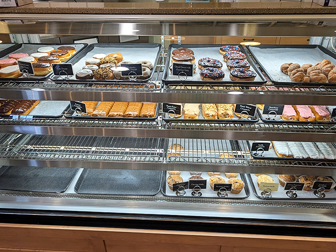 The pastry case: where willpower goes to die a delicious, sugar-coated death every single time.