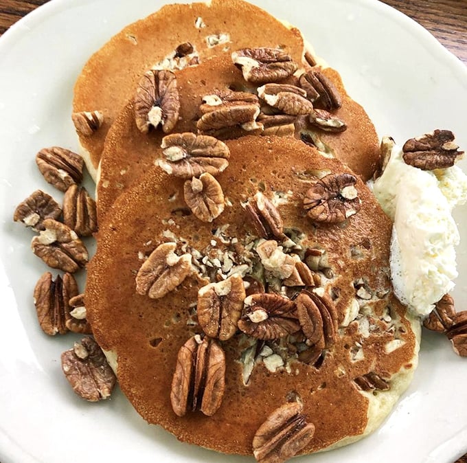 Pecan pancakes that strike the perfect balance between nutty crunch and fluffy cake &ndash; topped with a dollop of butter slowly melting into breakfast nirvana.