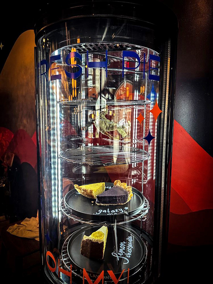 A dessert display case that's essentially a glass-enclosed museum of temptation. Resistance is futile, and honestly, why would you try?