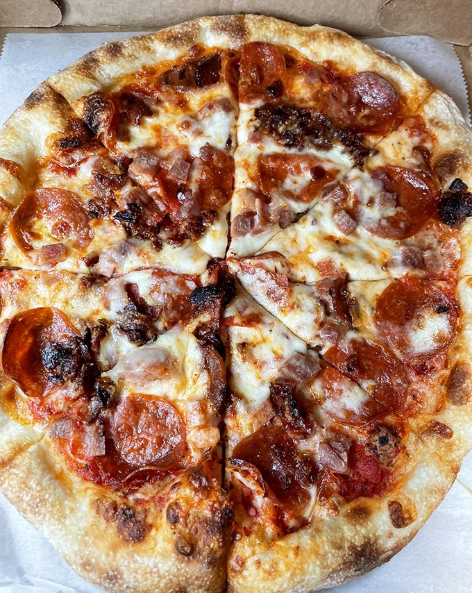 Pizza that proves bakeries can multitask. This pepperoni masterpiece shows what happens when bread experts decide to go circular and add toppings.