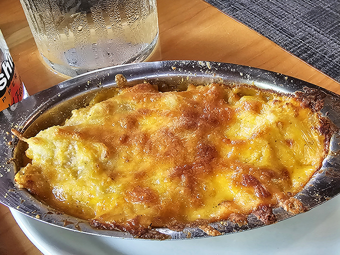 Potato au gratin that achieves the impossible: both creamy and crispy, with cheese that stretches from plate to fork like golden sunshine.