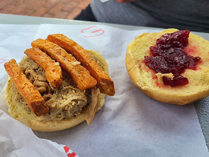 The pulled pork sandwich with sweet potato fries &ndash; proof that happiness doesn't need to be complicated, just served on a soft bun.