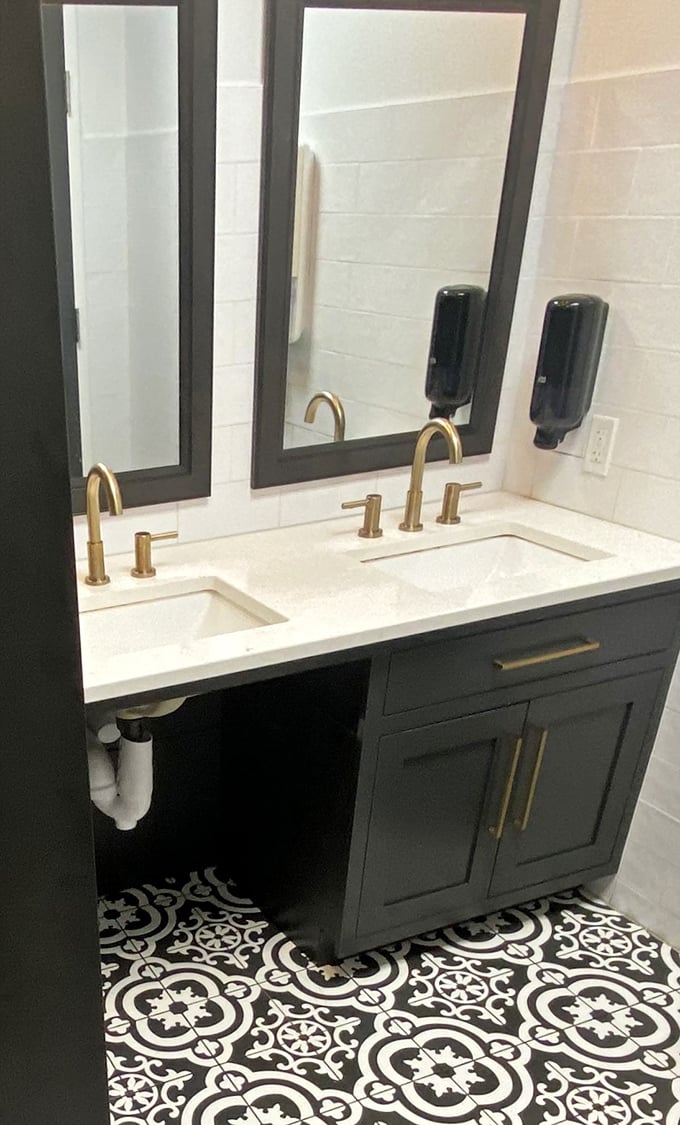 Even the restroom speaks to Agapē's attention to detail. Those brass fixtures and patterned tiles? Pure bathroom envy.