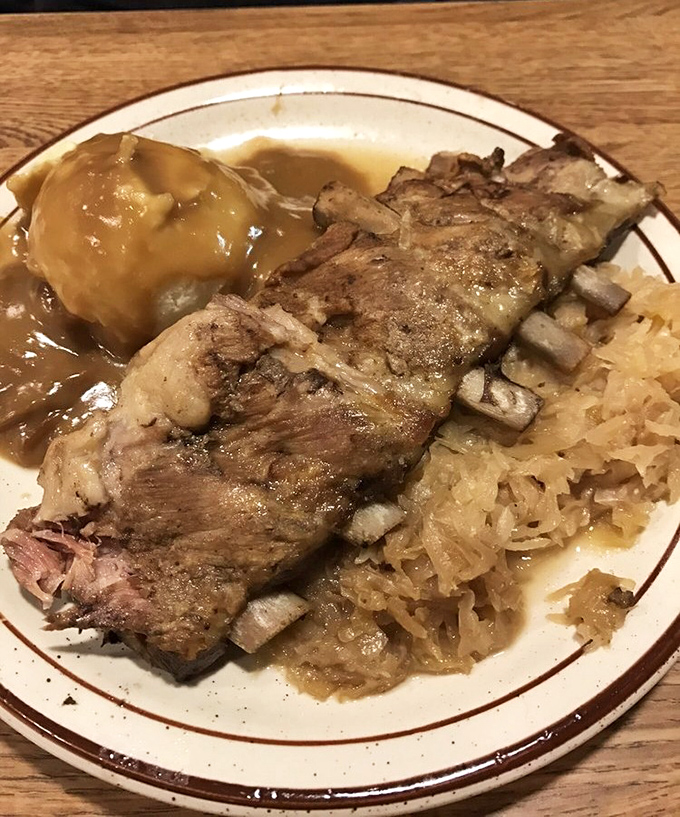 Fall-off-the-bone ribs nestled against tangy sauerkraut. A plate that proves sometimes the best things in life come swimming in their own juices.