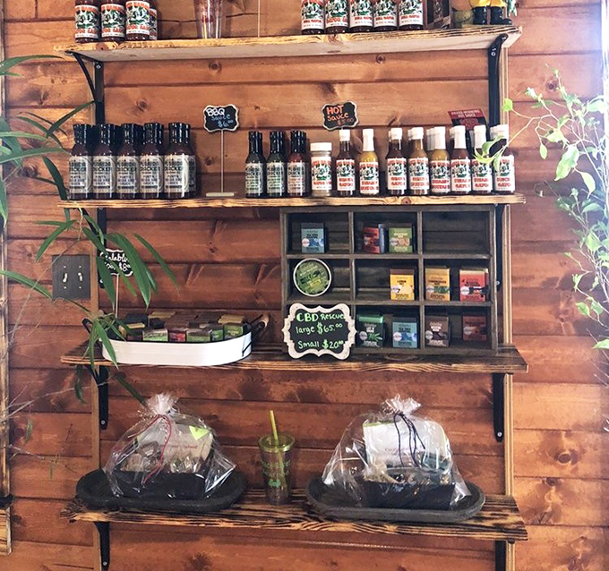 A wooden shelf stocked with local sauces and seasonings. Take home a taste of Florida&mdash;no fishing license required.