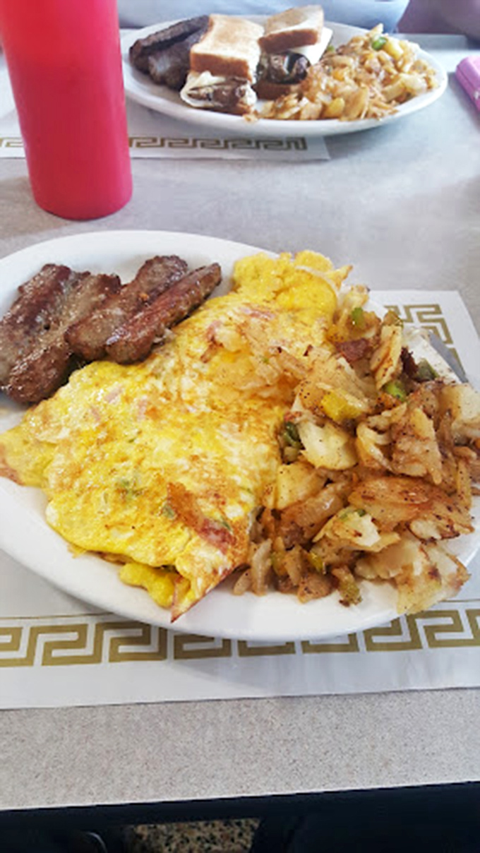 An omelet that's seen things, flanked by home fries that didn't come from a freezer bag. This is breakfast with integrity.