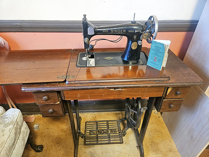 A vintage Singer sewing machine stands ready for its second act. Crafters dream of finding such well-preserved pieces of functional history.