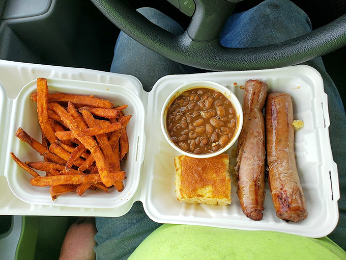 The to-go container that makes your car smell like heaven for days &ndash; sweet potato fries, baked beans, and sausage worth the drive.