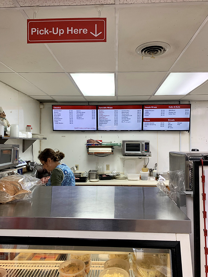 Behind every great sandwich is someone with skilled hands and sandwich wisdom. The kitchen choreography here is poetry in motion.