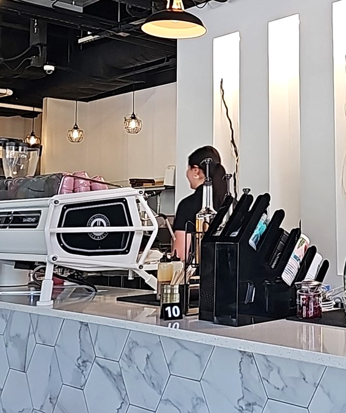 Behind the marble counter, baristas craft espresso drinks with the focus of artists, turning morning fuel into something worth savoring.