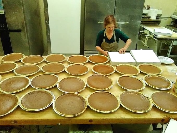 Behind every great pie is a baker with flour-dusted hands and the patience of a saint. This production line of pie shells promises delicious things to come.