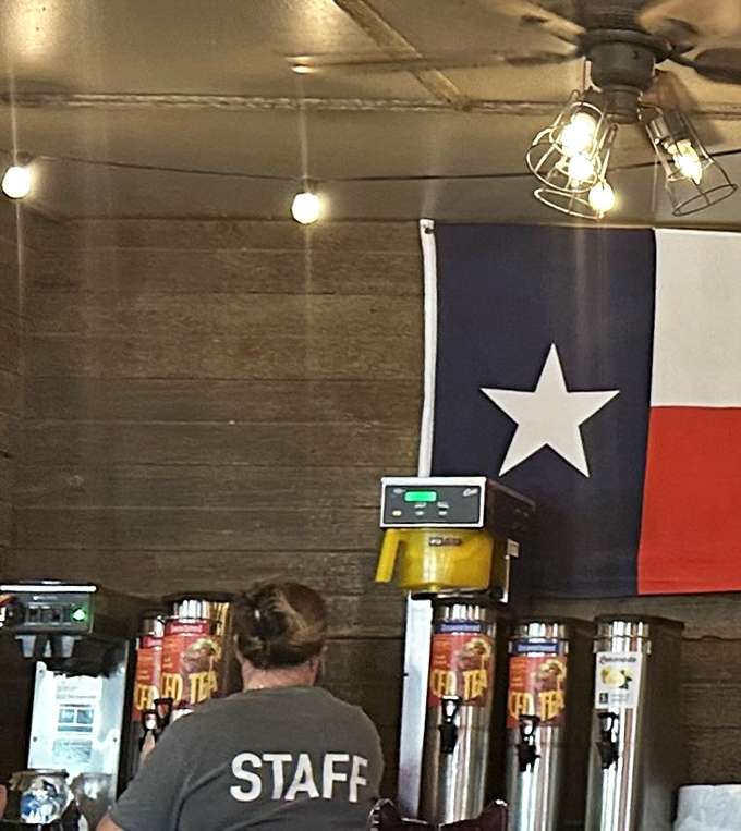 Behind every great barbecue joint is dedicated staff, keeping those tea urns filled under the watchful eye of the Texas flag.
