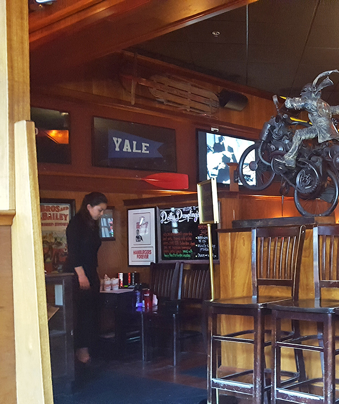 The warm wooden interior houses college pennants and vintage decor, creating that perfect "I've discovered somewhere special" feeling that keeps locals coming back. 