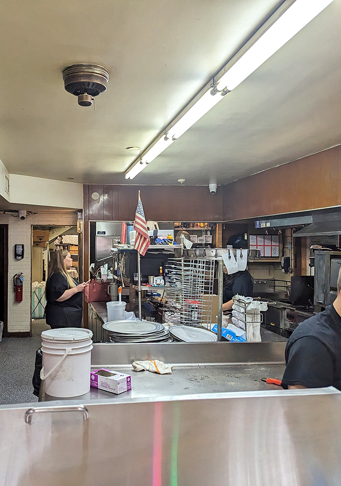 Behind every great pizza stands a team of dedicated professionals who've perfected their craft through decades of service.