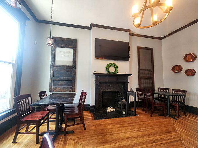 Vintage charm meets modern comfort in this dining space where the fireplace has likely witnessed countless first dates and anniversary celebrations.