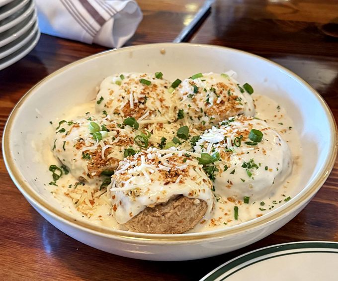 These stuffed mushrooms aren't just appetizers&mdash;they're conversation starters. Creamy, cheesy little flavor bombs that make small talk unnecessary.