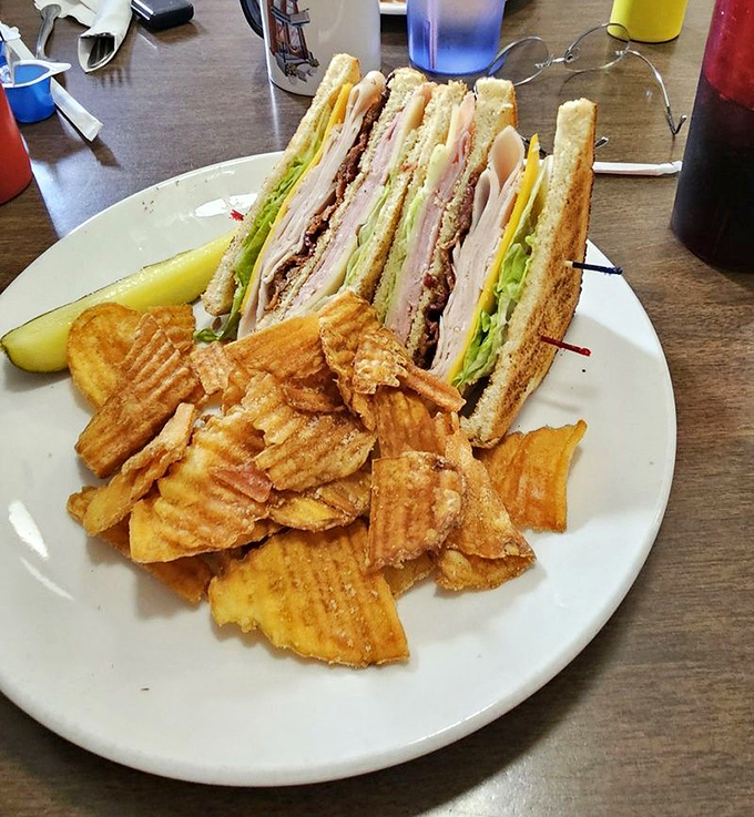 The club sandwich&mdash;architectural marvel of the lunch menu. Three stories of deliciousness held together by those fancy toothpicks you're definitely keeping.