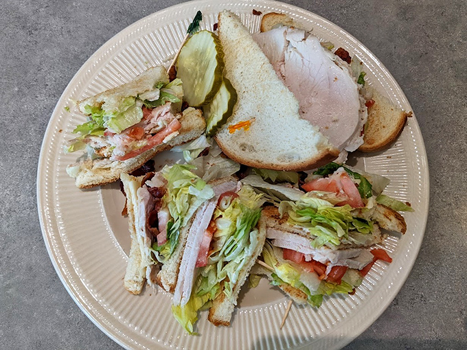 The club sandwich: America's three-story answer to hunger. Layers of turkey, bacon, and veggies between bread that's been toasted to perfection.