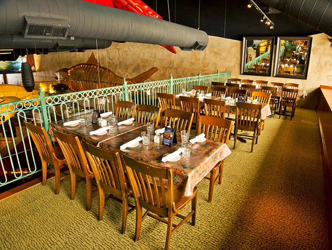 Wooden chairs, white tablecloths, and nautical touches create the perfect backdrop for seafood stories that will become family legends.