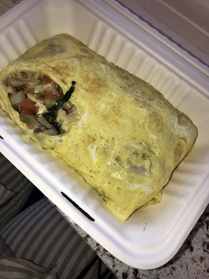 This isn't just an omelet—it's a vegetable delivery system disguised as comfort food. The kind of breakfast that makes you feel virtuous and indulgent simultaneously.