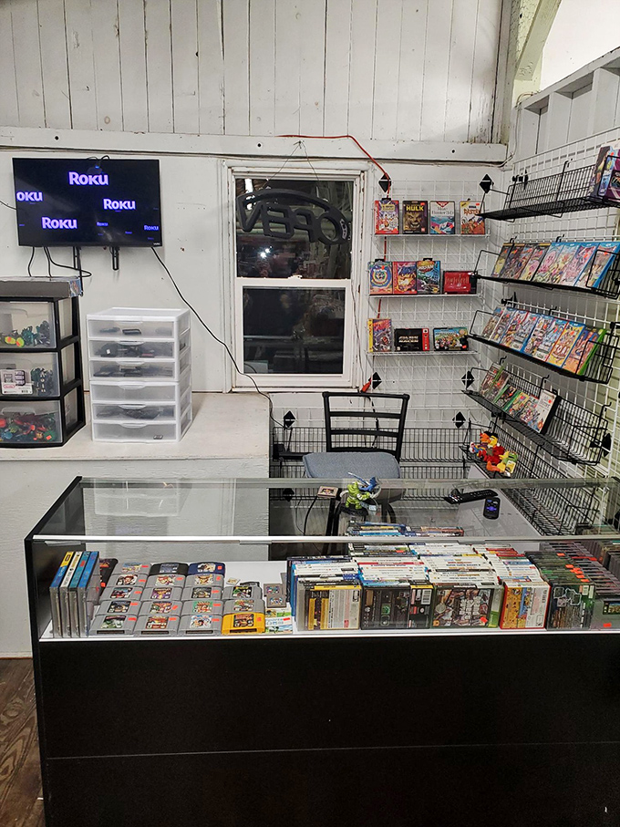 Video game nostalgia corner where middle-aged visitors suddenly remember cheat codes they haven't used since the Clinton administration. Gaming history preserved under glass.