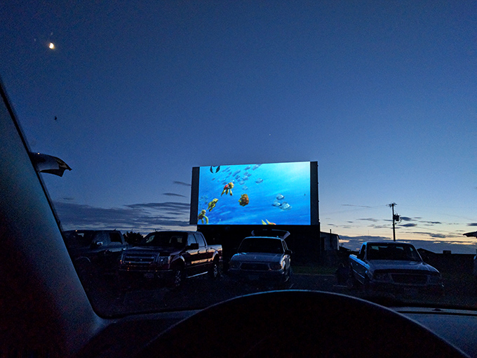 From the comfort of your car, animated adventures unfold against the darkening sky&mdash;no pause button, no distractions, just pure movie magic.