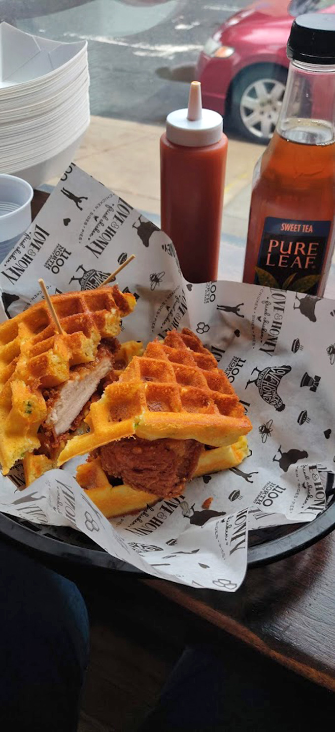Chicken and waffles reimagined&mdash;crispy fried chicken nestled between golden waffles. Breakfast? Lunch? The only label it needs is "delicious."