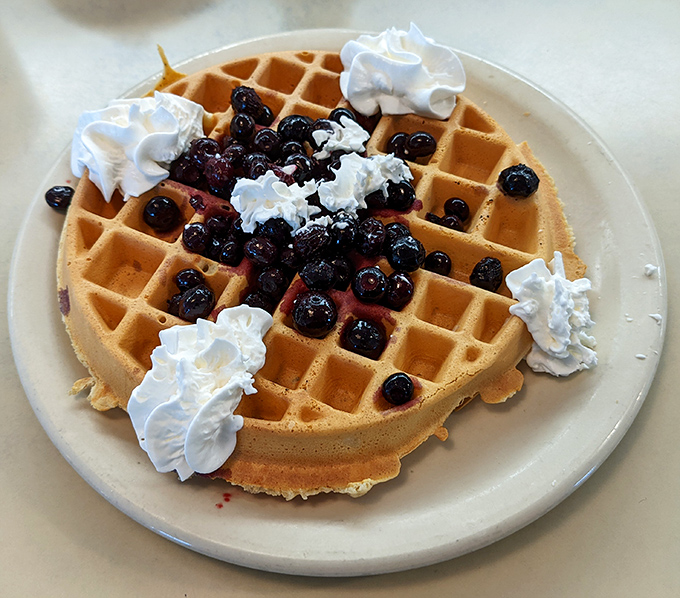 A Belgian waffle that's dressed for success with berries, whipped cream, and the power to turn any morning into a celebration.