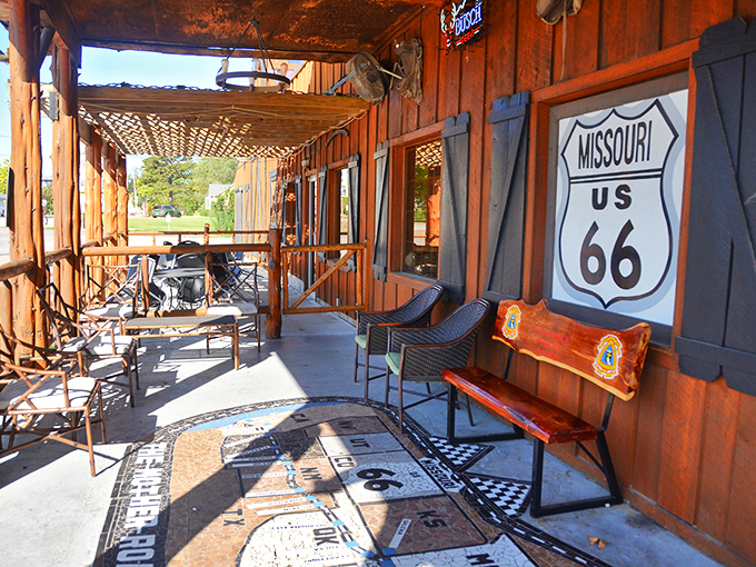The porch seating area features Route 66 memorabilia and enough rustic charm to make Chip and Joanna Gaines take notes.