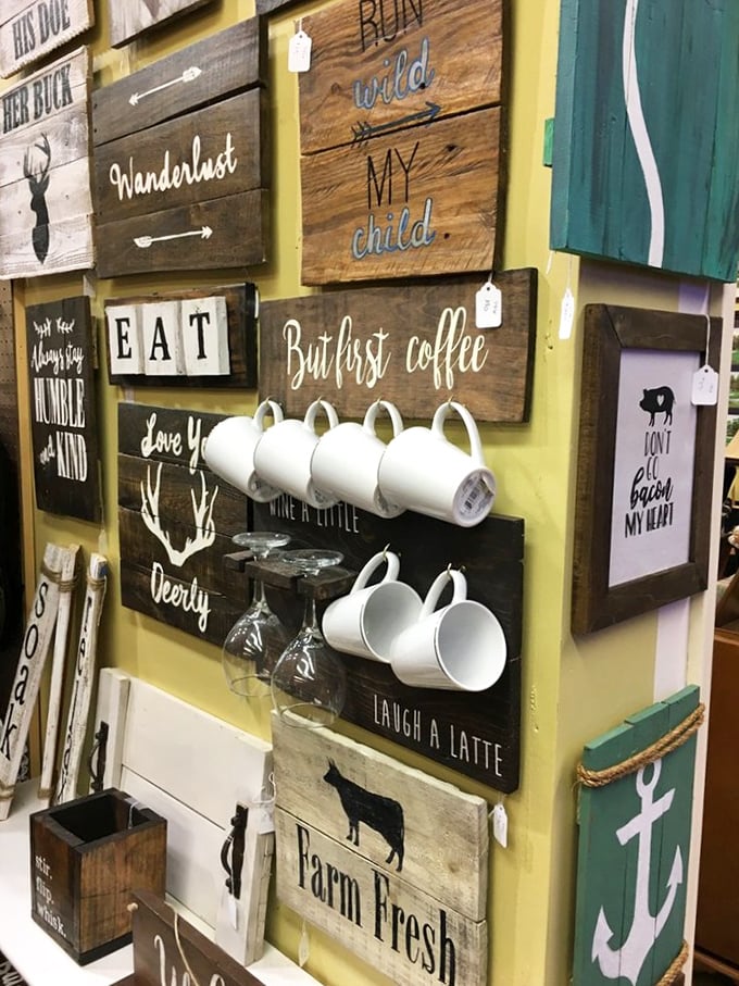Coffee mugs hanging like trophies on rustic wood signs&mdash;proof that even everyday objects become art in the right hands.