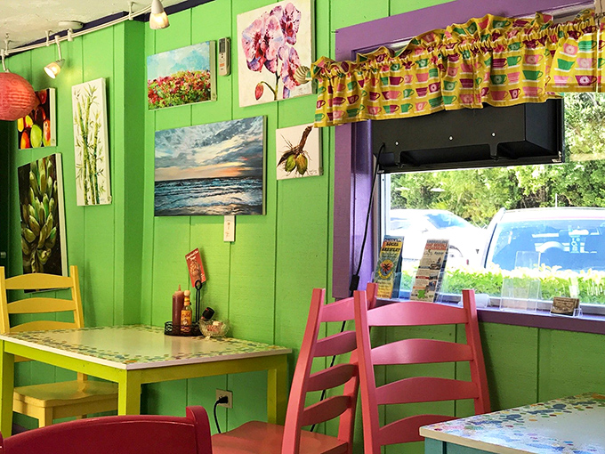 Local artwork brightens lime-green walls while colorful curtains frame windows like tropical bunting at the world's happiest breakfast party.