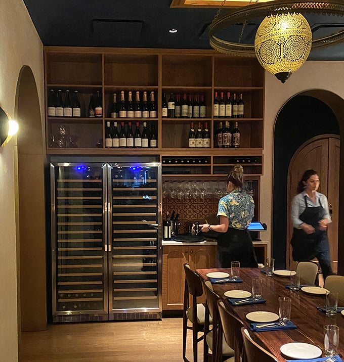 Behind every great meal is a thoughtfully curated wine collection. This elegant storage wall is where Mediterranean bottles find their temporary home.